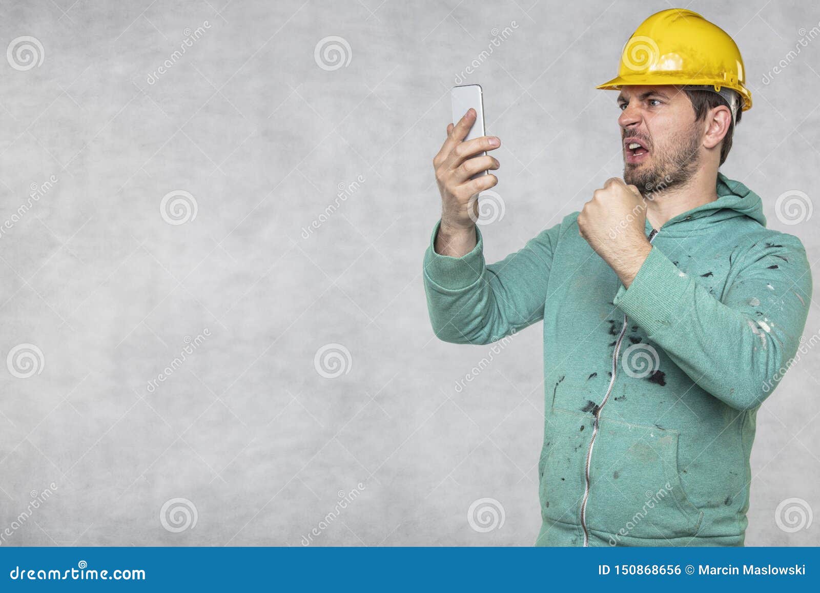 A Construction Supervisor is Screaming into a Cell Phone, Clenching a ...