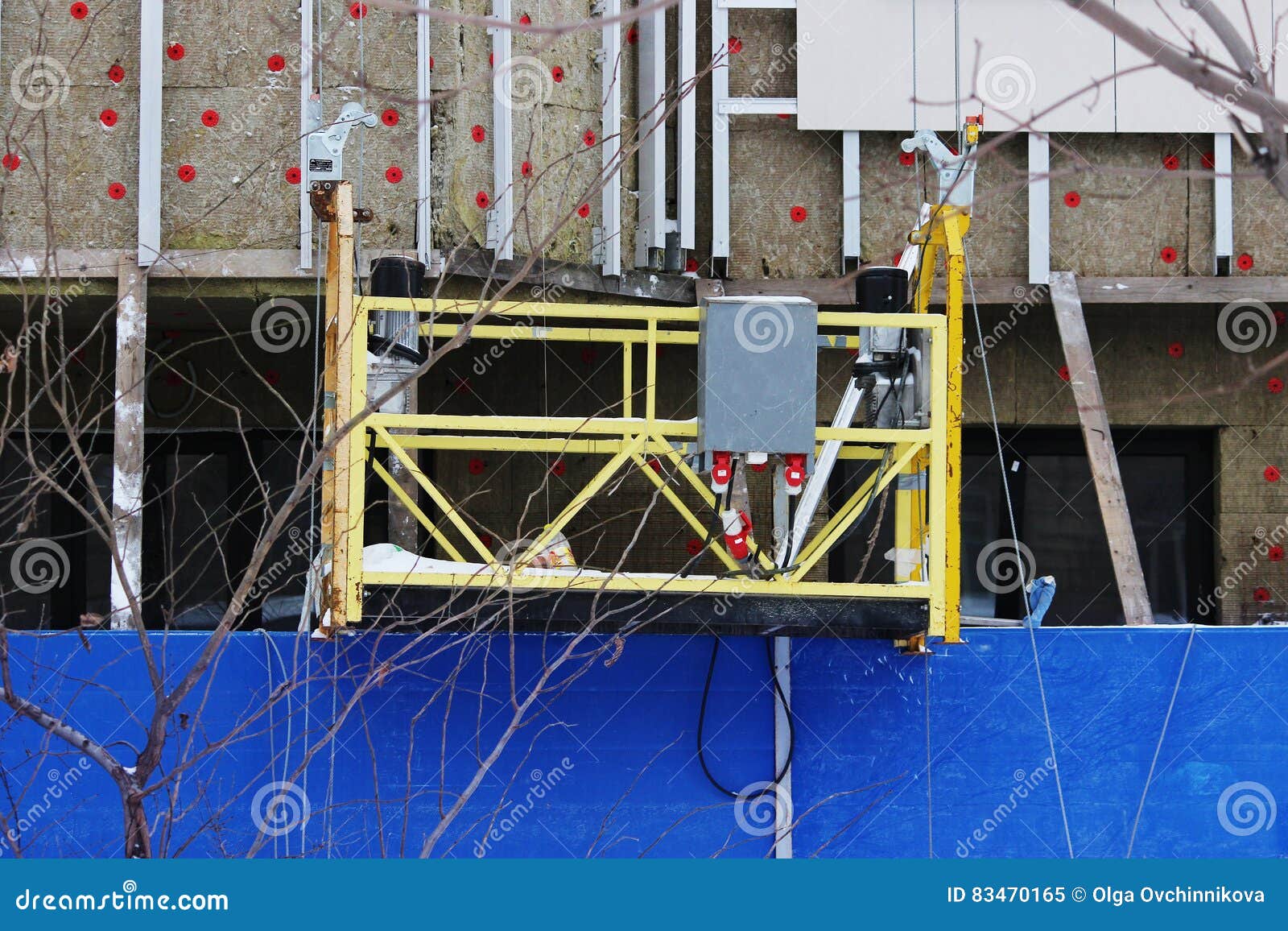 Construction Suspended Yellow Cradle without Workers on a Newly Built ...