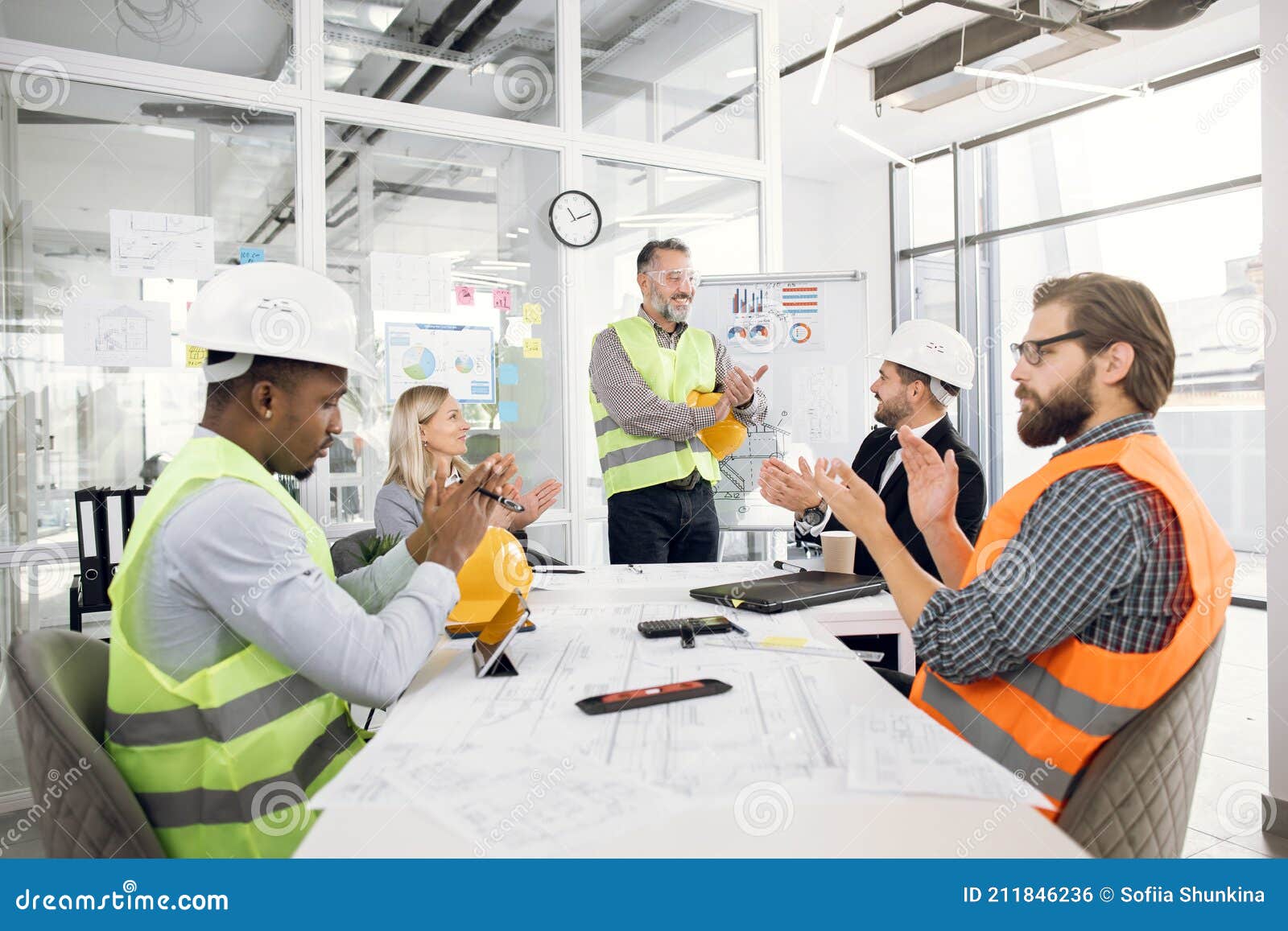 Construction Team Applauding during Presentation of Project Stock Photo ... Construction Team Applauding during Presentation of Project Stock Photo ...