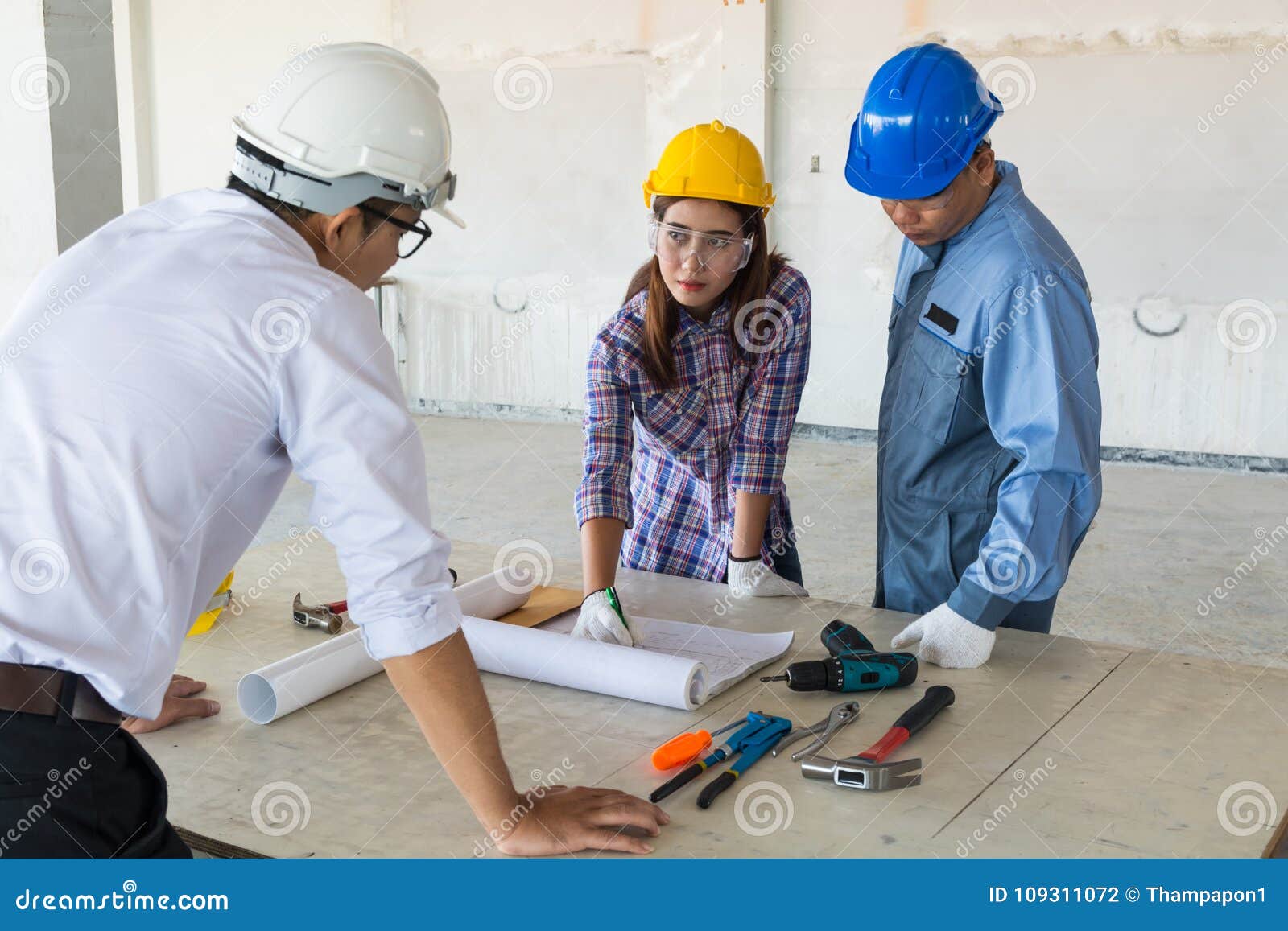 Construction Team, Architect, Engineer and Foreman Discussing Stock ... Construction Team, Architect, Engineer and Foreman Discussing Stock ...