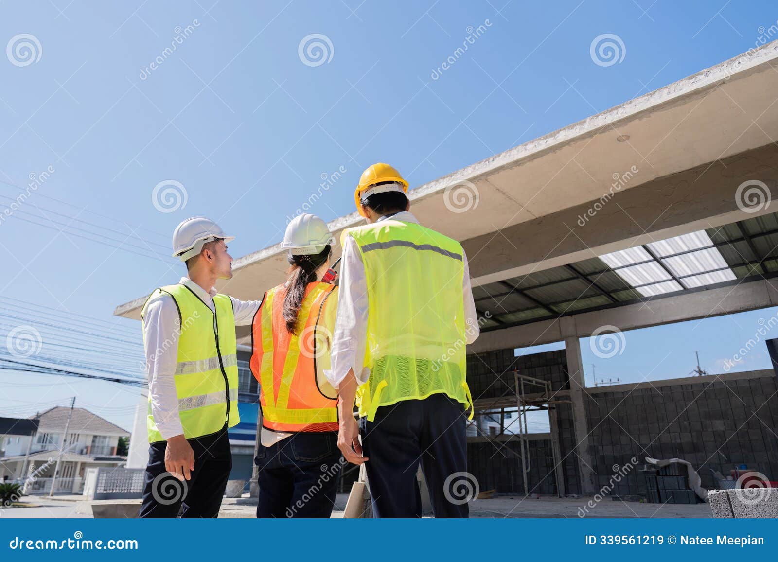Construction Team Evaluating Building Progress on Site. Inspection and ...