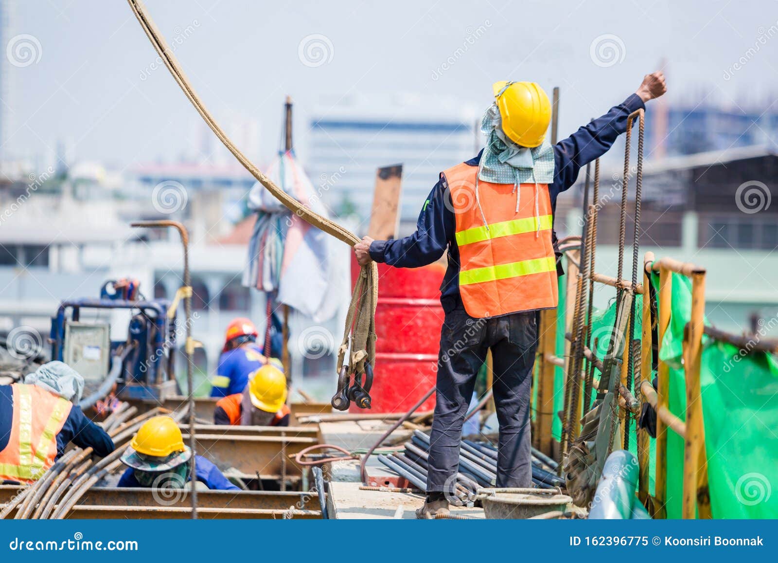 Construction Team Working at Height Site. Construction Workers Raising ...