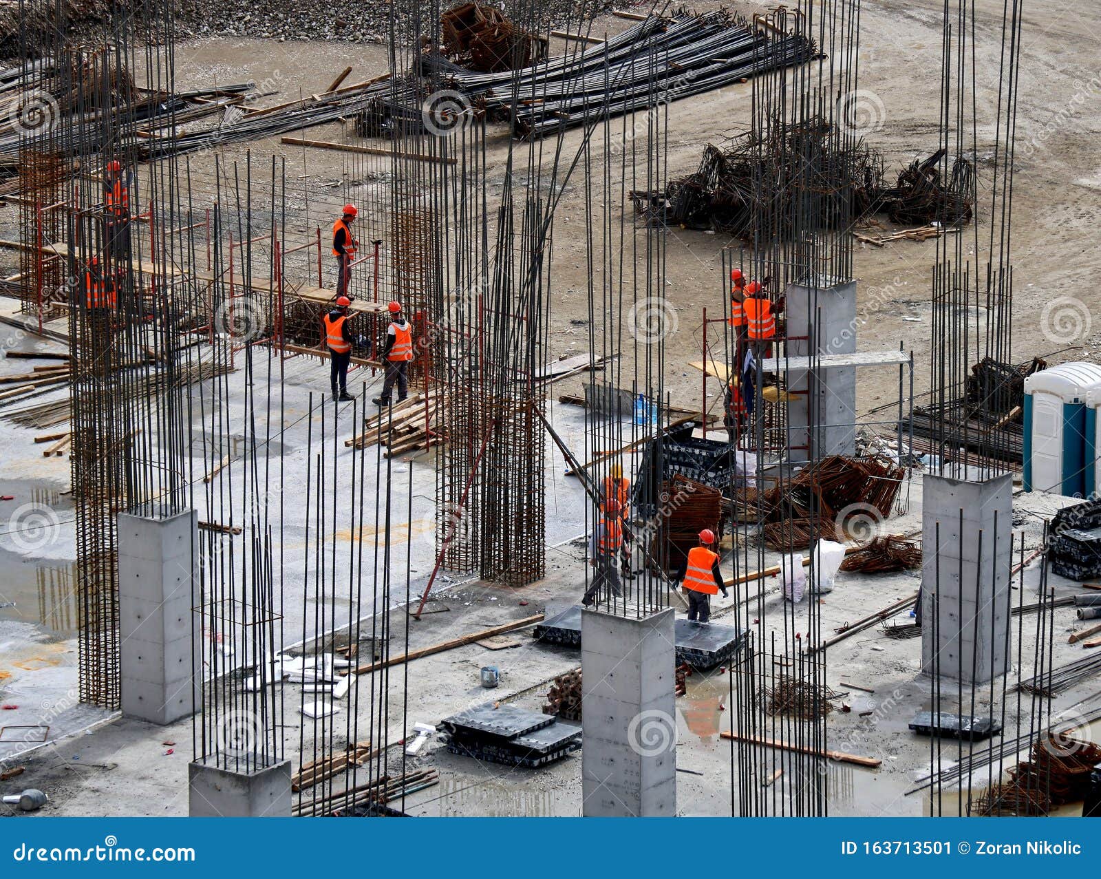 Laborers Working on Modern Construction Site Editorial Photo - Image of ...