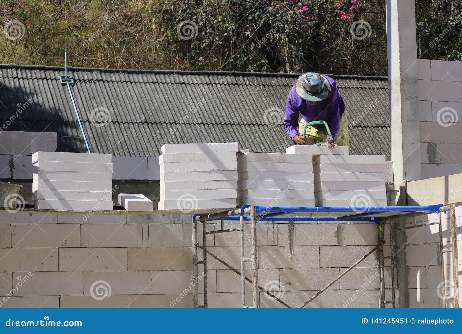 Construction Technicians are Building Brick Walls with Lightweight ...