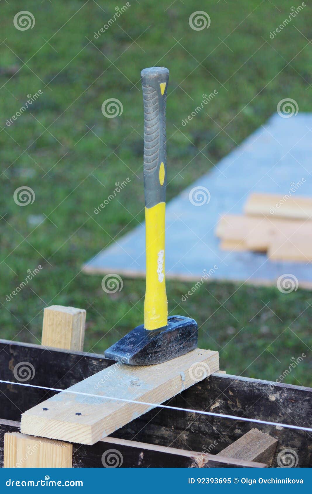 Construction Tool Hammer with a Yellow Handle Lies on the Formwork ...