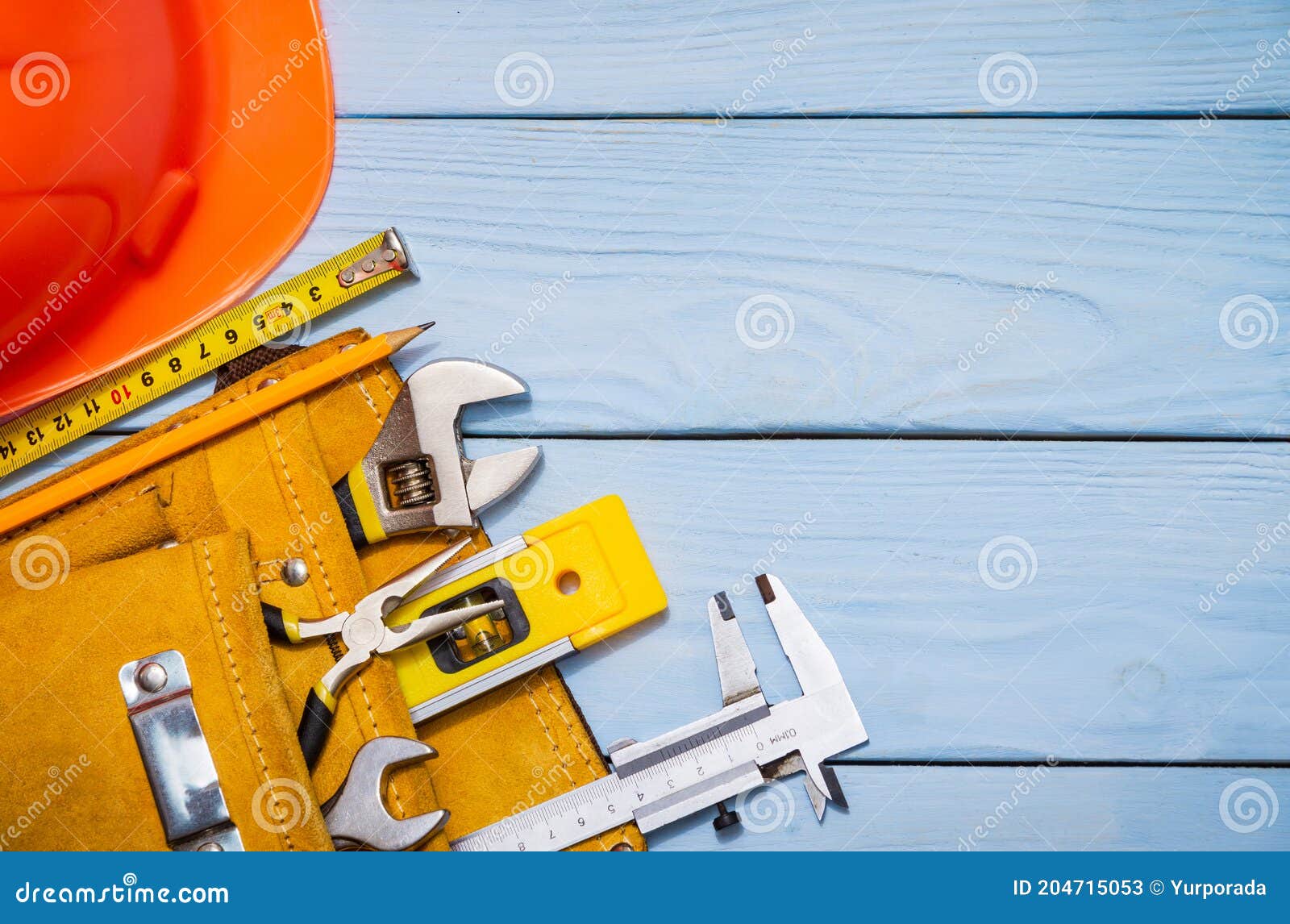 Construction Tool Kit for Builder in Bag on Blue Wooden Boards Also ...