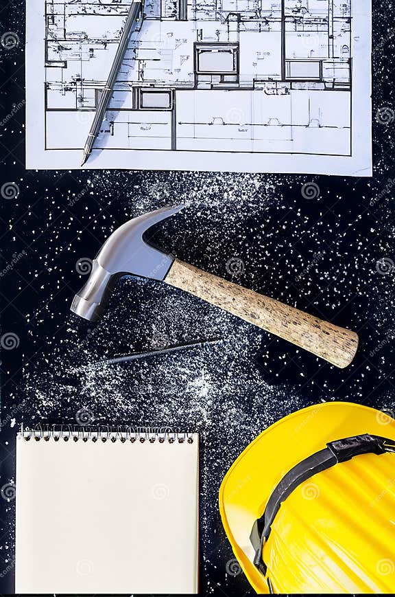 Construction Tools and Blueprint on a Dark Surface, Featuring a Hammer ...