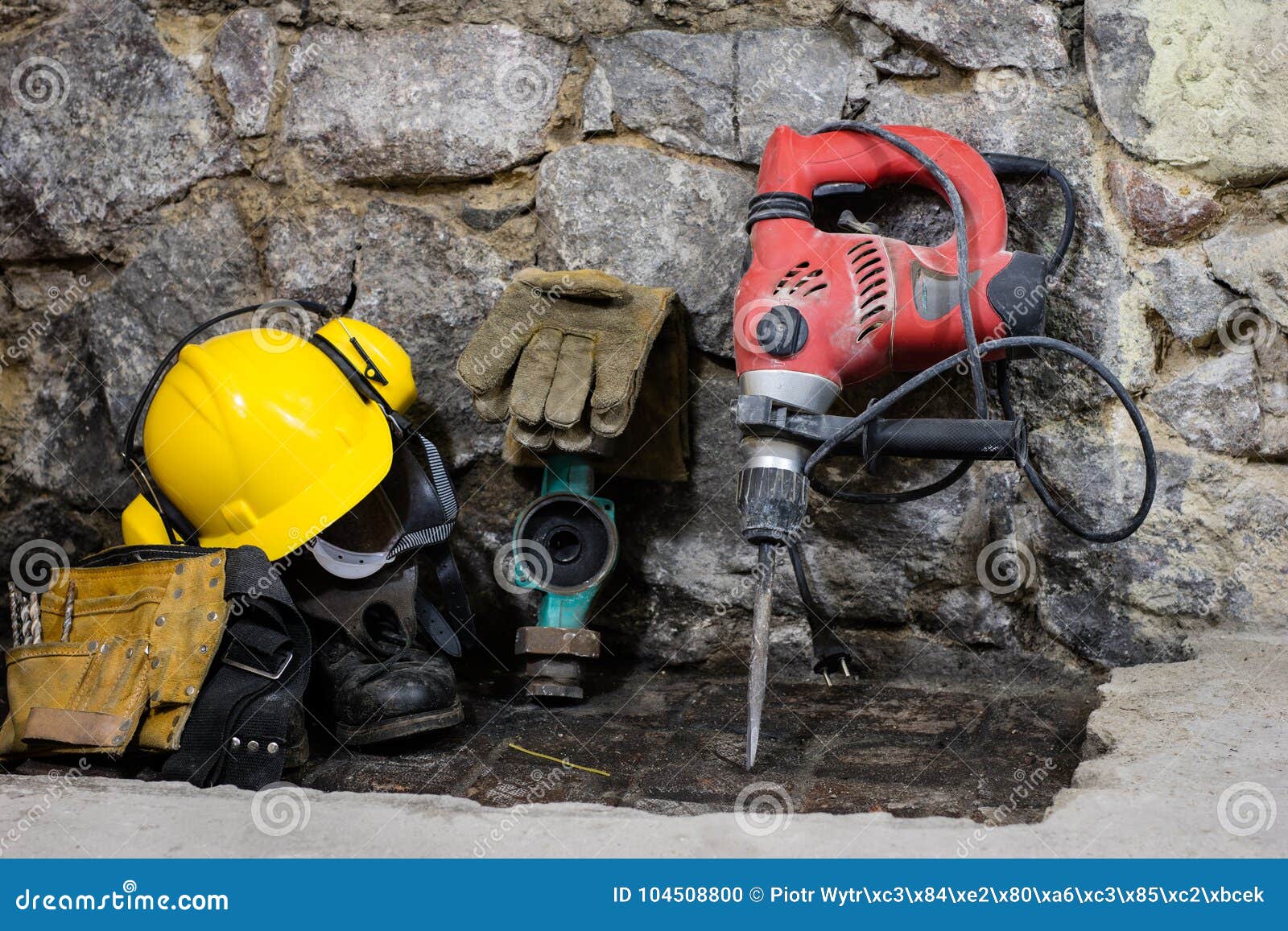 Construction Tools for Building a House on a Stone Wall. Hammer, Helmet ...