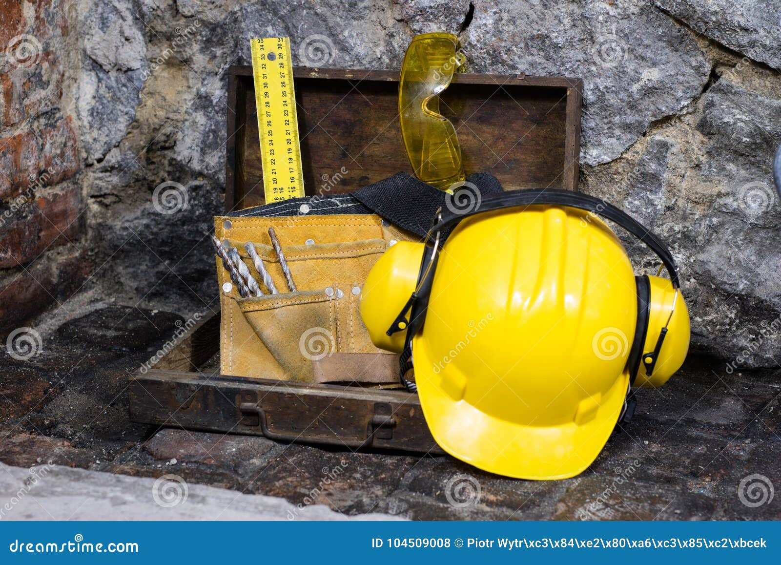 Construction Tools for Building a House on a Stone Wall. Hammer, Helmet ...