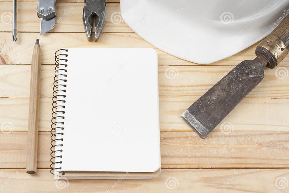 Construction Concept.Work Tools, White Helmet, Notepad and Pencil on ...