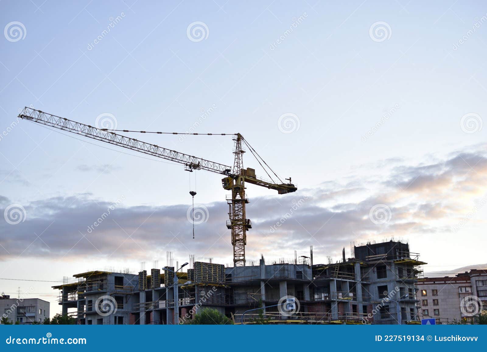 Construction Tower Crane in the City at Sunset Stock Photo - Image of ...