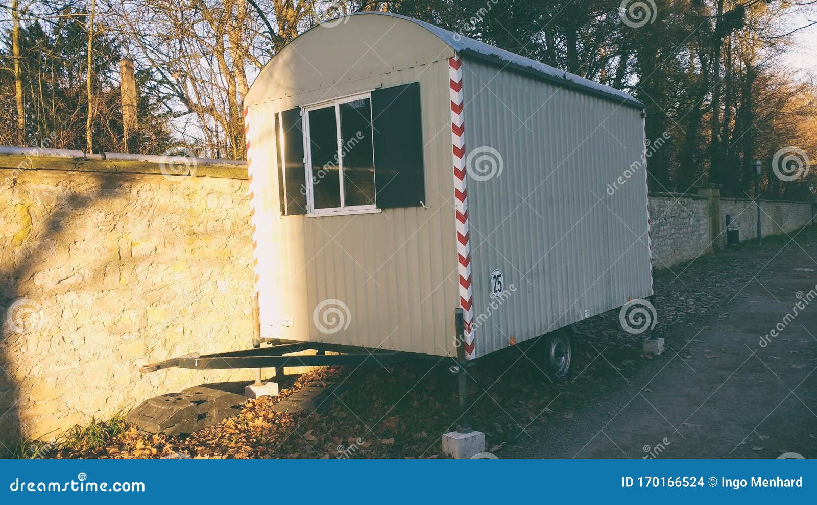 Construction Trailer in Front of an Old Stone Wall Stock Photo - Image ...