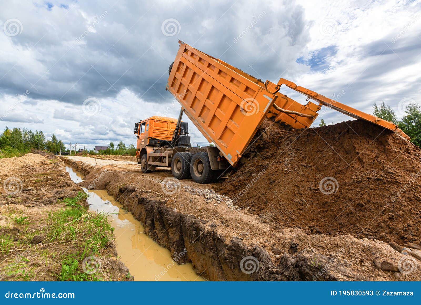 Construction Truck Tipping or Dumping Sand on Road during Construction ...