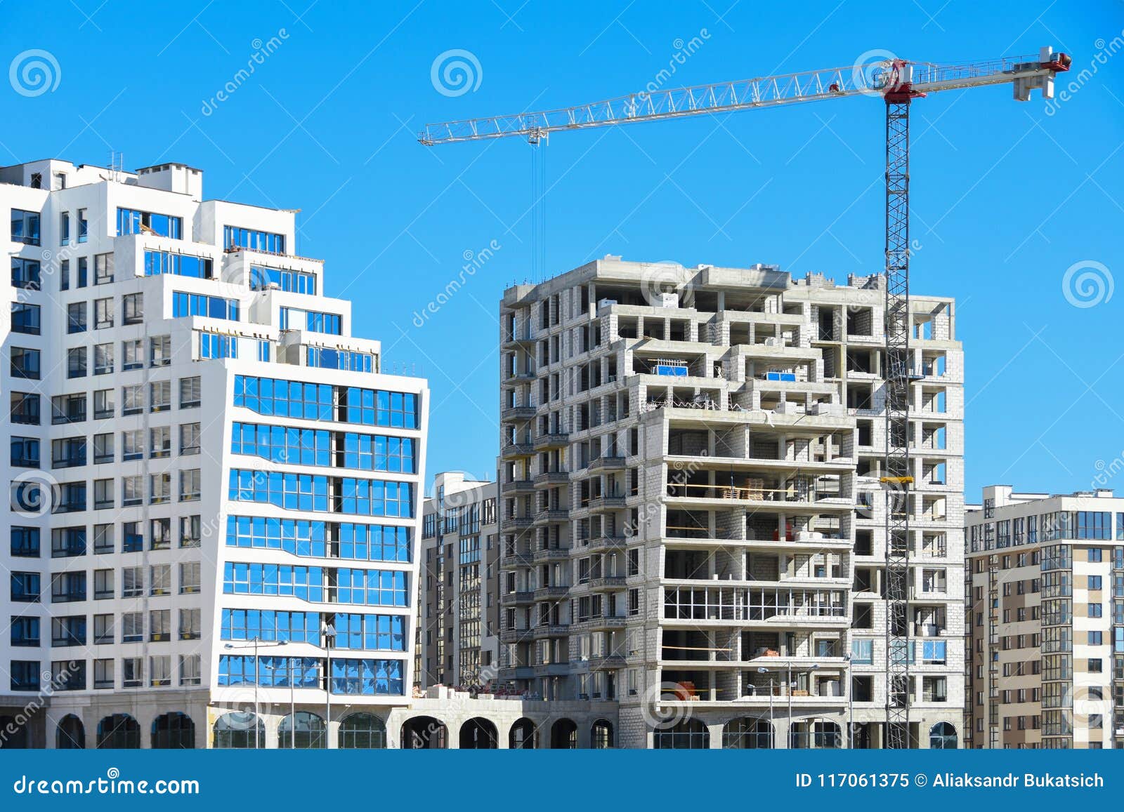 Construction of Two Identical Tall Buildings of White Blocks Against a ...