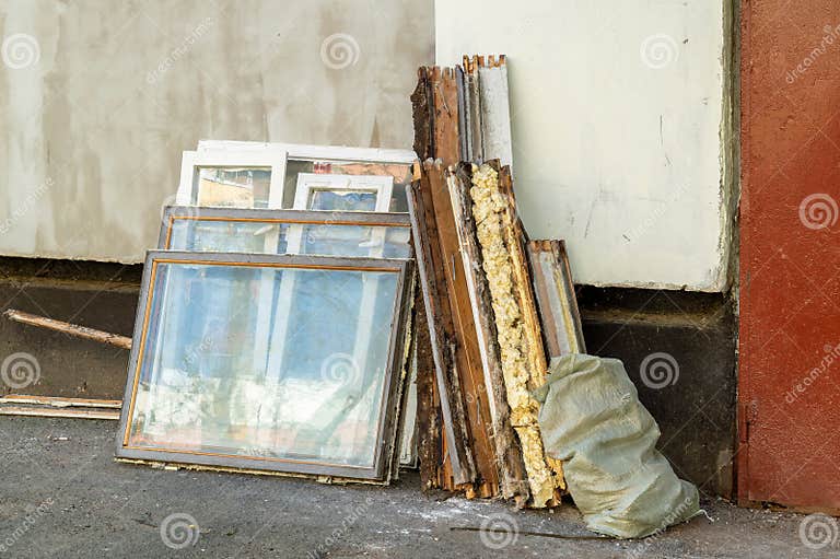 Construction Waste. Old Window Frames Stacked for Disposal Stock Photo ...