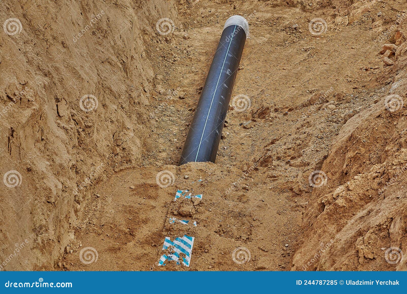 Construction of a Water Fence. the Plastic Water Pipe Lies in the ...