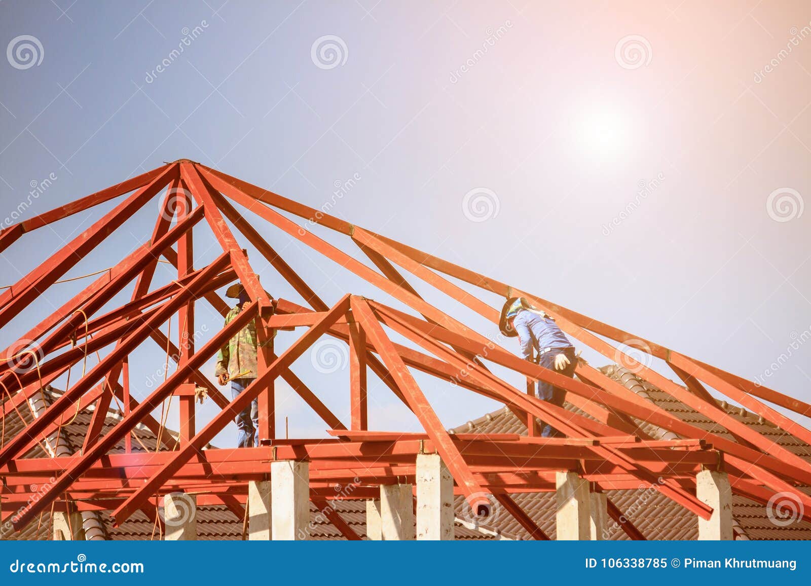 Welder Workers Installing Steel Frame Structure of the House Stock ...
