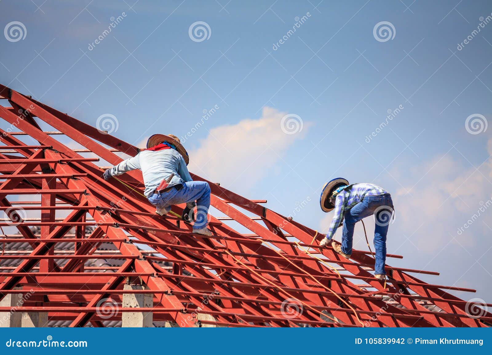 Welder Workers Installing Steel Frame Structure of the House Stock ...