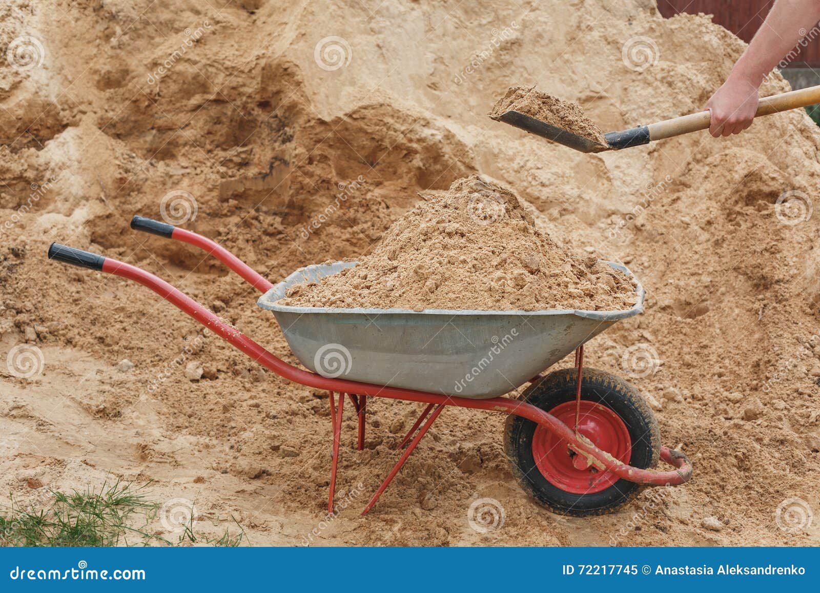 Construction Wheelbarrow With Loaded Curb Concrete Blocks At A ...