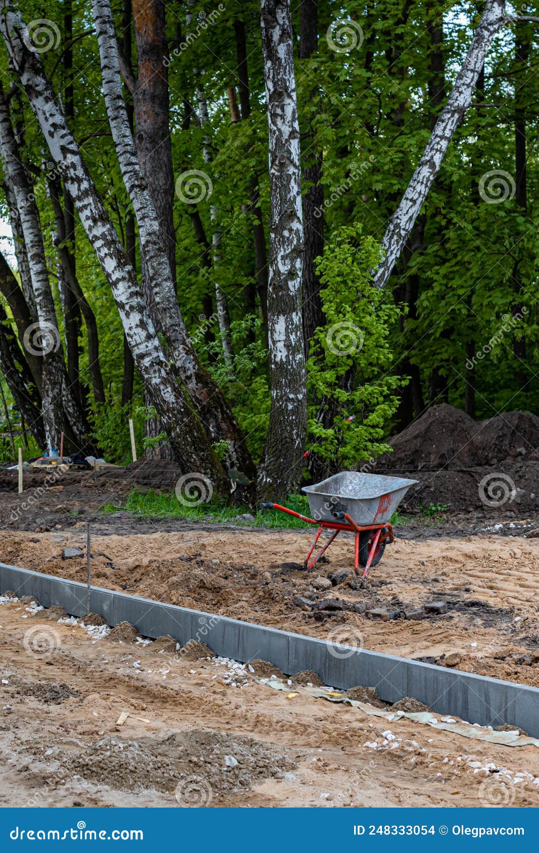 Construction Wheelbarrow Stands on the Site of the Construction of the ...