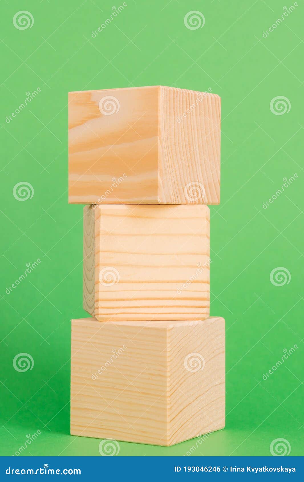 Construction of Wooden Cubes on Green Background with Copy Space ...