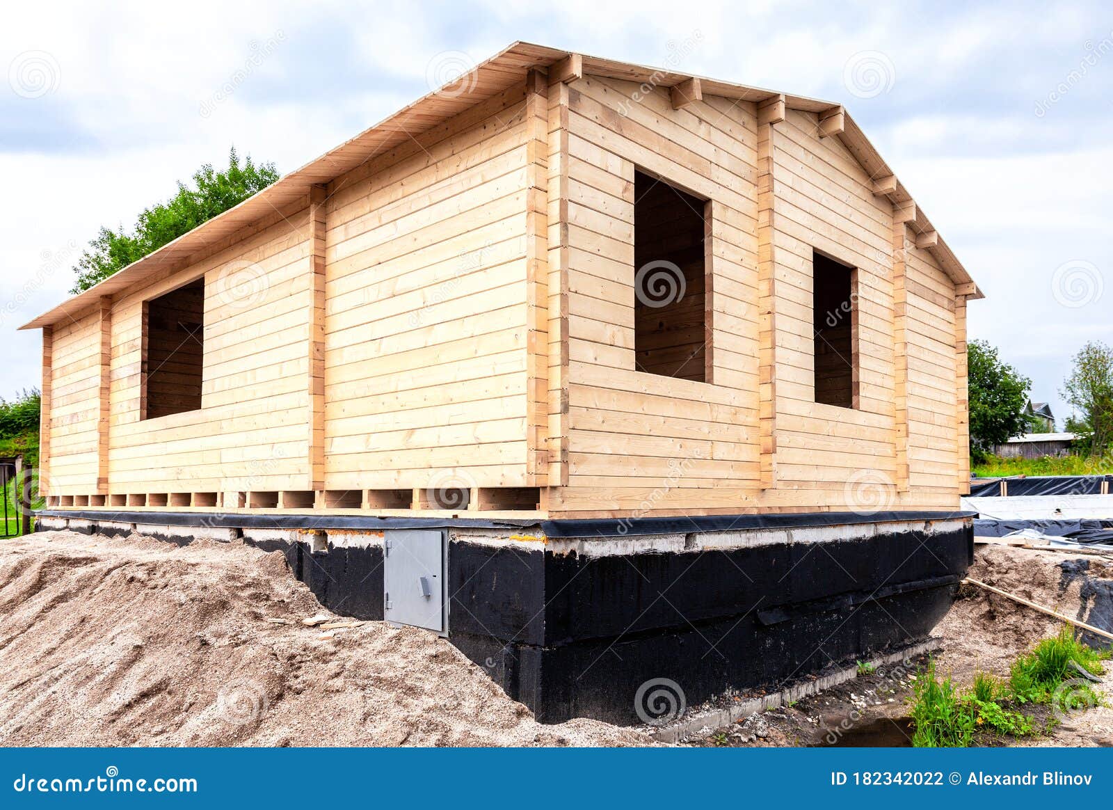 Construction of Wooden House on the Stone Foundation Stock Photo ...