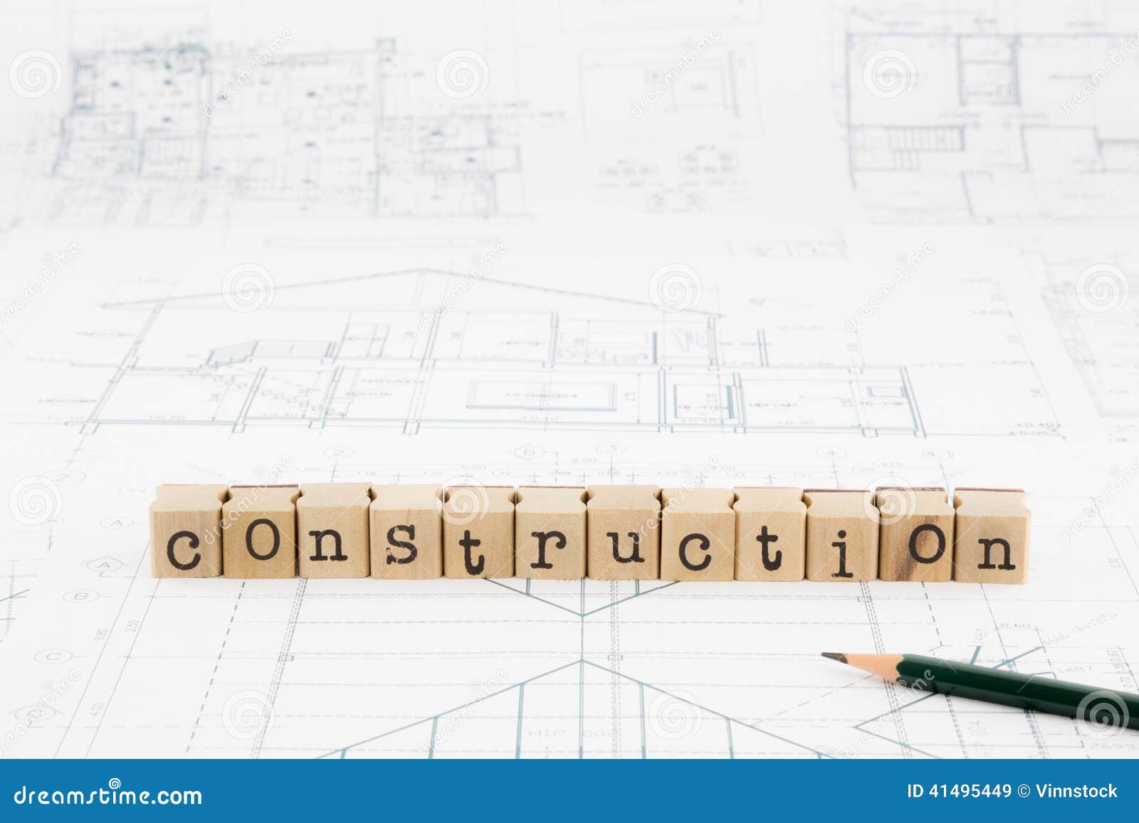 Construction Word Blocks Stack on Blueprints and Floor Plan Stock Image ...