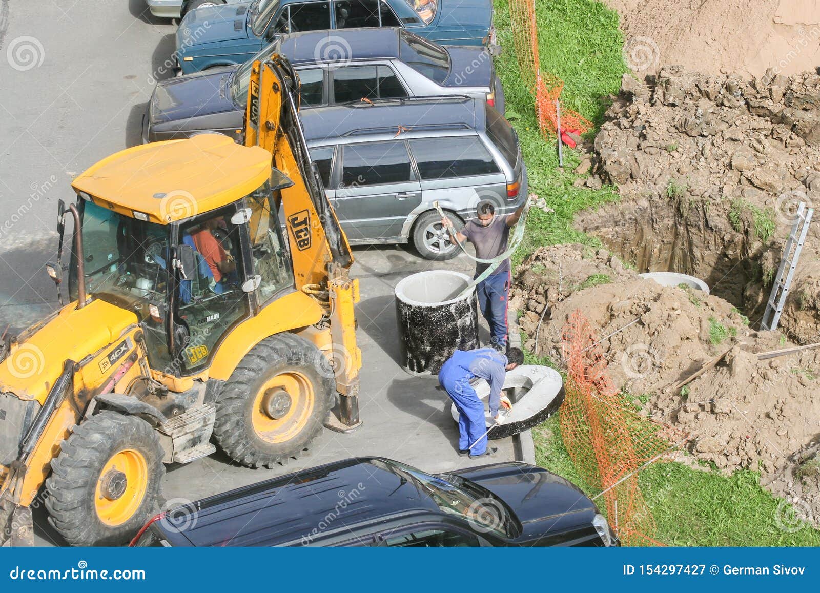 Construction Work between Cars Editorial Photography - Image of tractor ...
