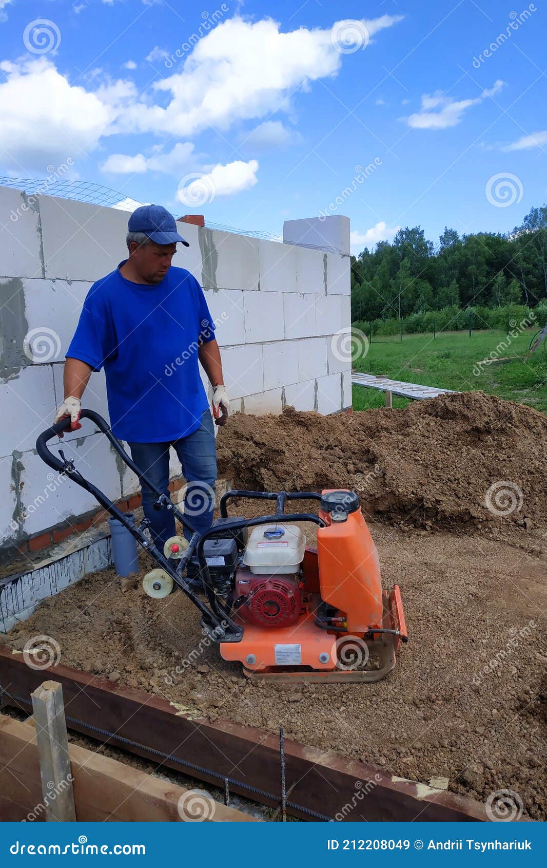 Construction Work on the Construction Site, Soil Compaction with a ...