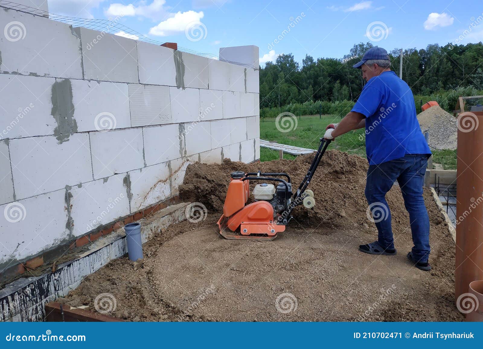 Construction Work on the Construction Site, Soil Compaction with a ...