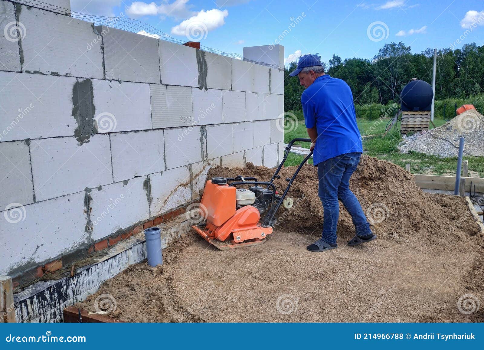 Construction Work on the Construction Site, Soil Compaction with a ...