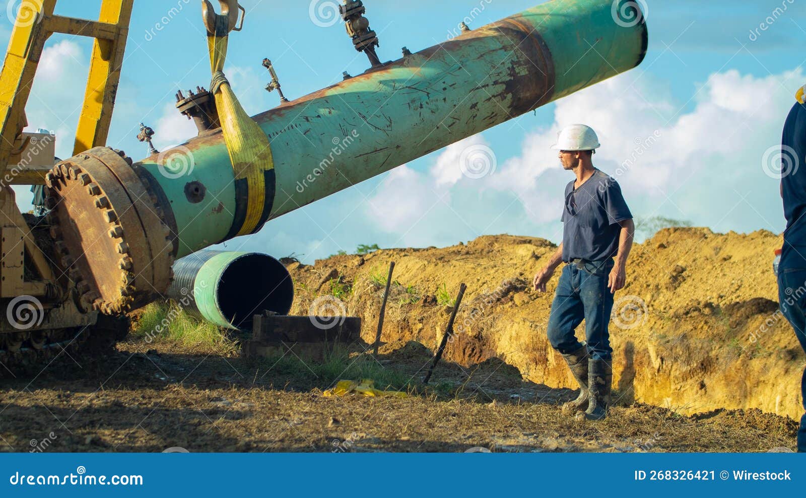 Construction Work- the Crane Lifting the Beam in the Field and the ...