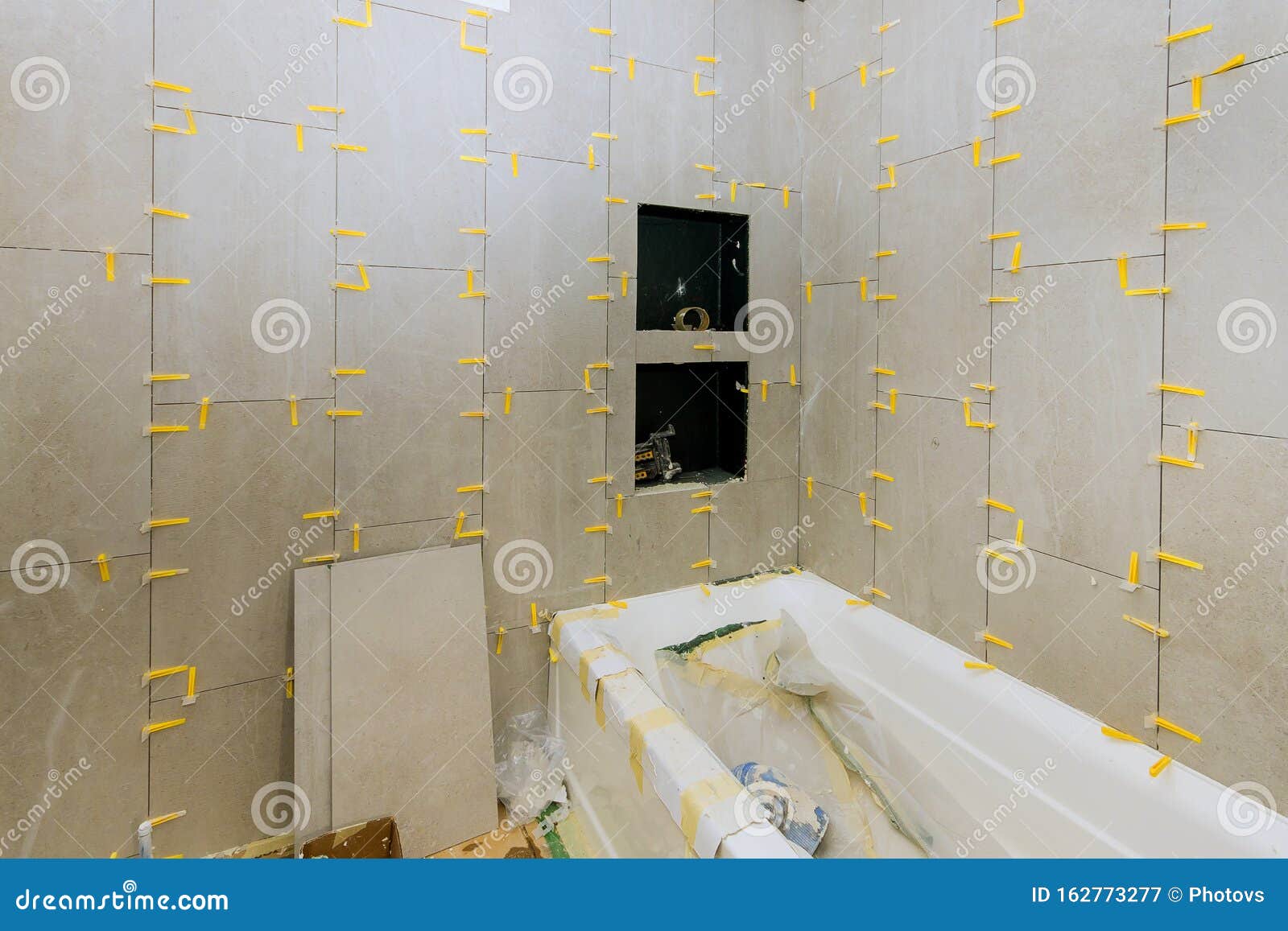 Construction Work Installing Ceramic Tile on Reconstruction of Bathroom ...