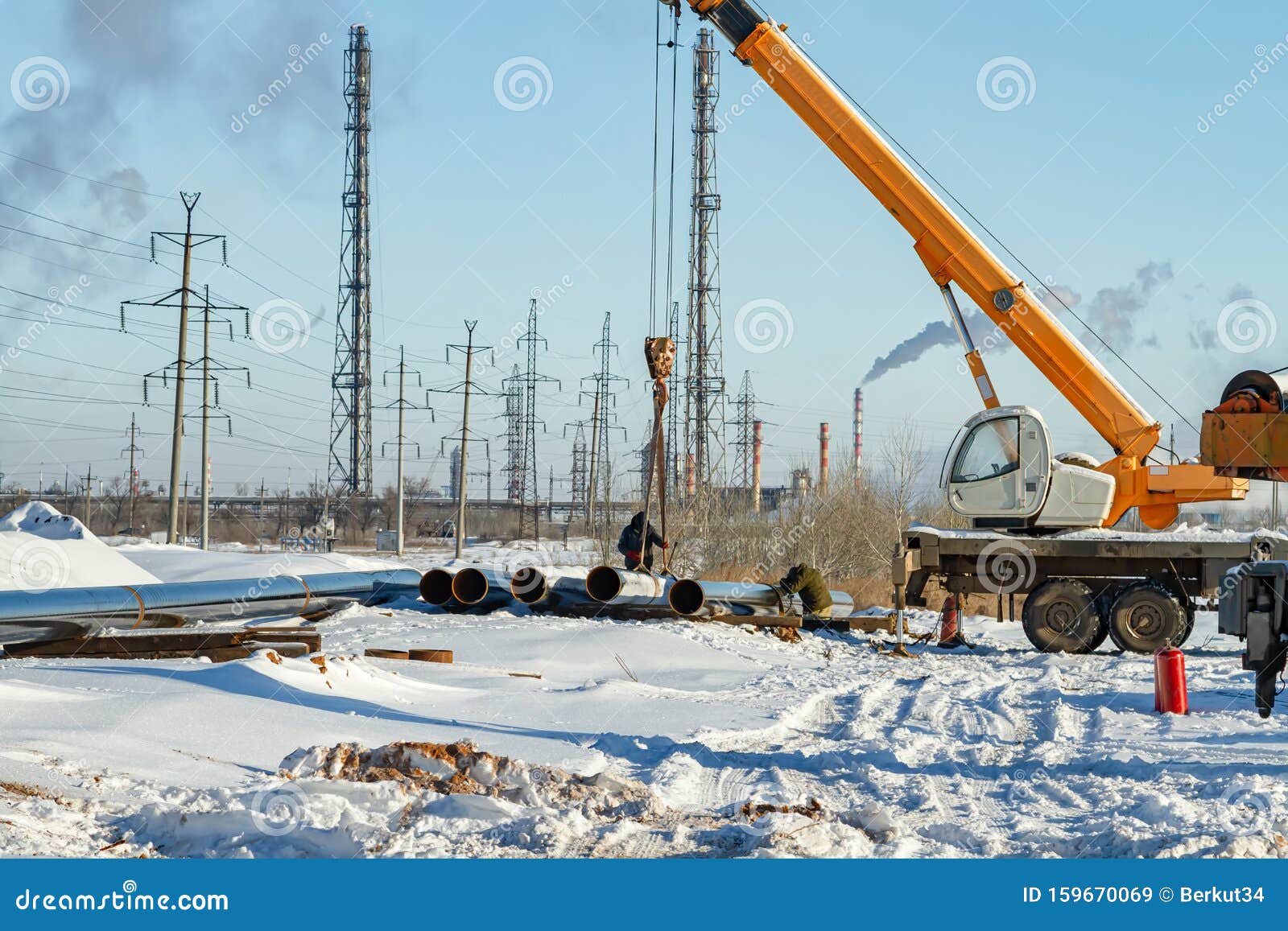 Construction Work on Pipe Laying of Pipeline into the Trench Using a ...