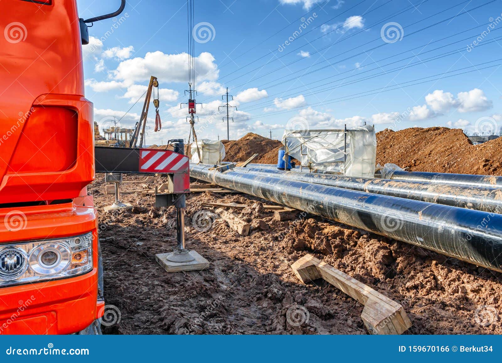 Construction Work on Pipe Laying of Pipeline into the Trench Using a ...