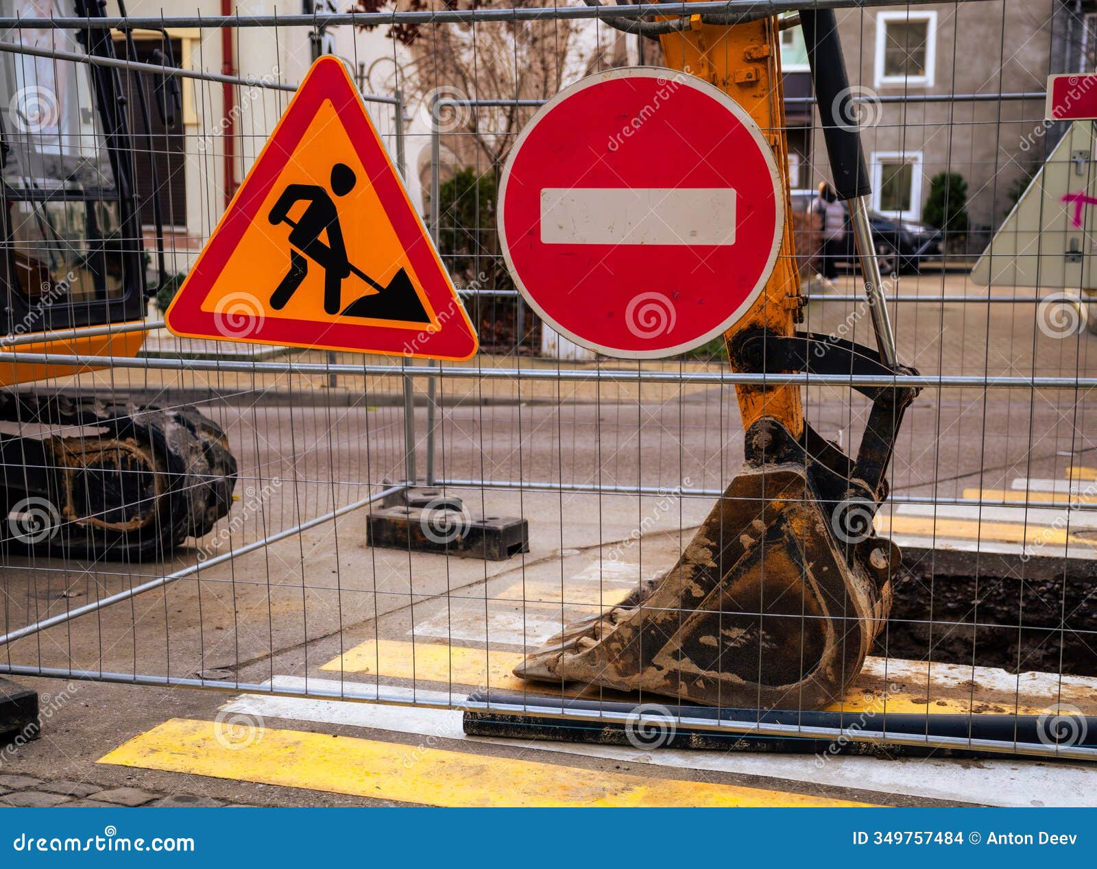Construction Work in Progress with Warning Signs and Equipment on City ...