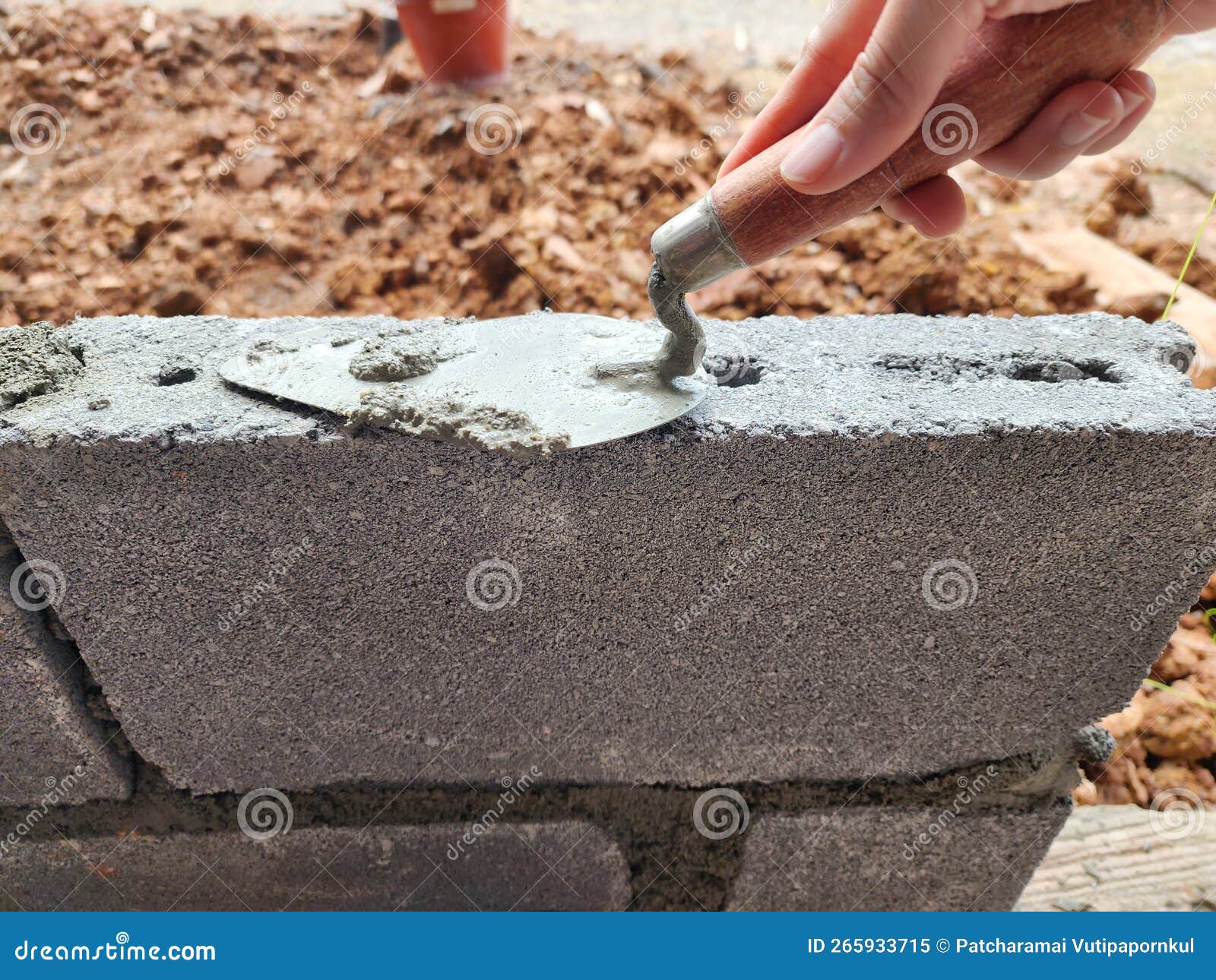 Construction Work by Putting Bricks Together and Plastering the Walls ...