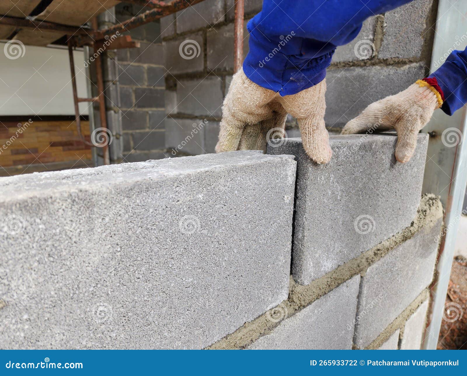Construction Work by Putting Bricks Together and Plastering the Walls ...