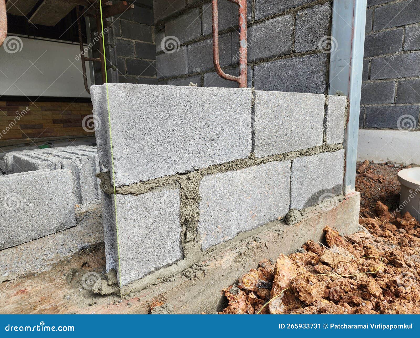 Construction Work by Putting Bricks Together and Plastering the Walls ...