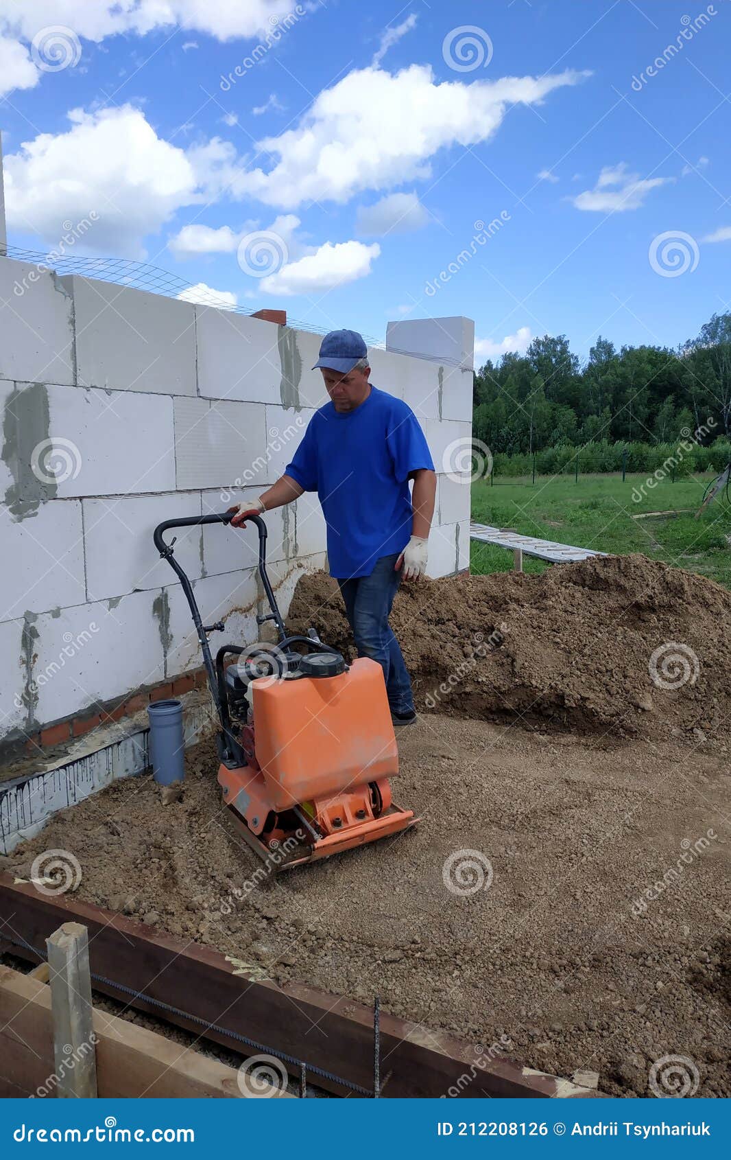 Construction Work on the Construction Site, Soil Compaction with a ...