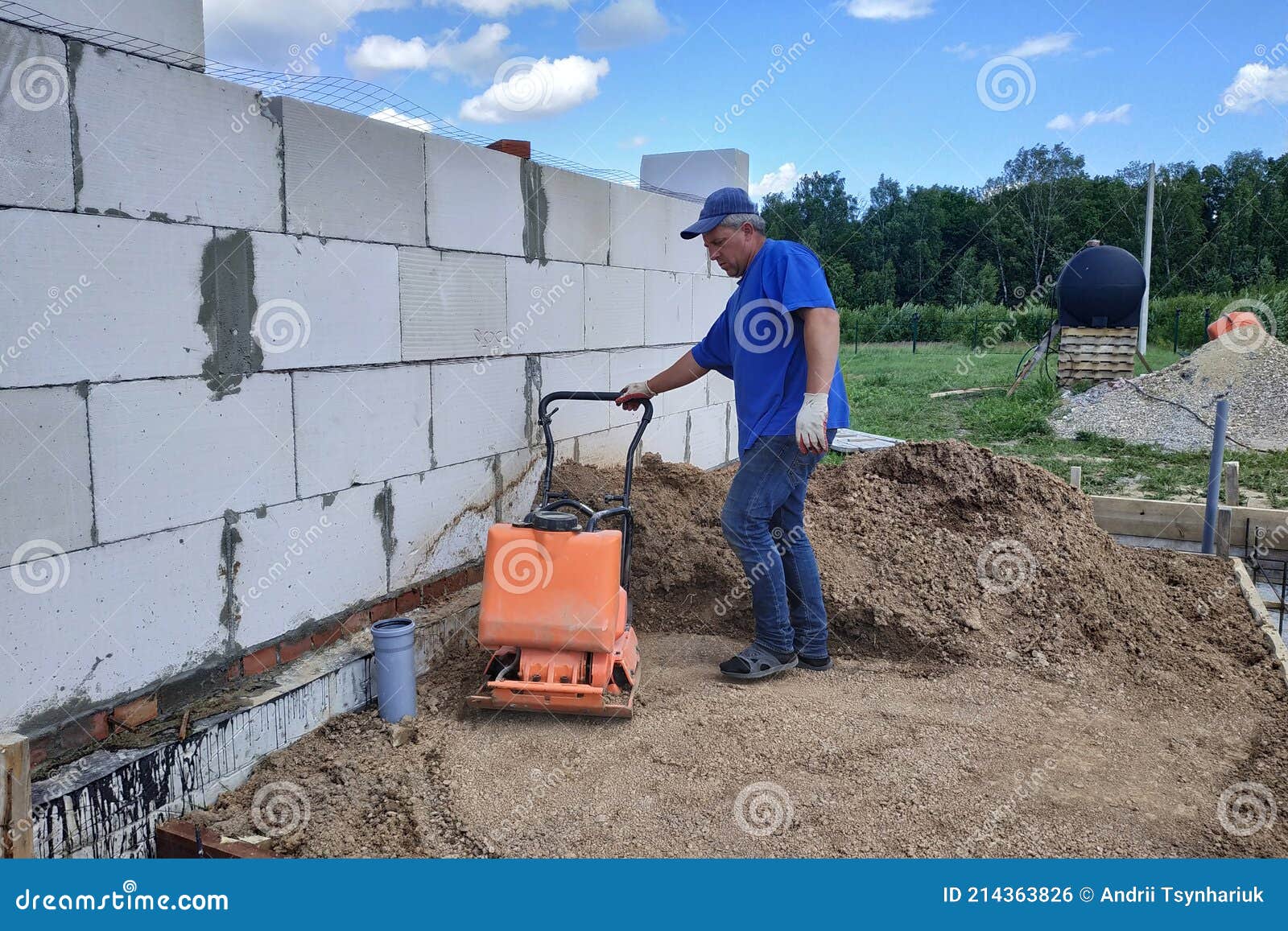 Construction Work on the Construction Site, Soil Compaction with a ...