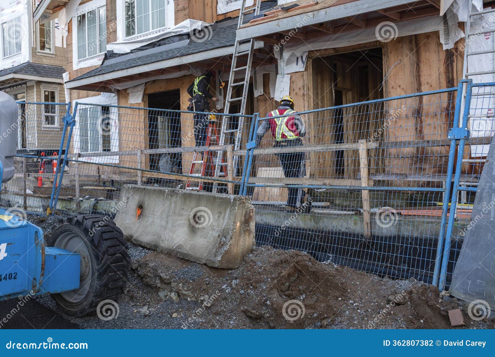 Construction Work Site with Cladding Being Installed on the Outside of ...