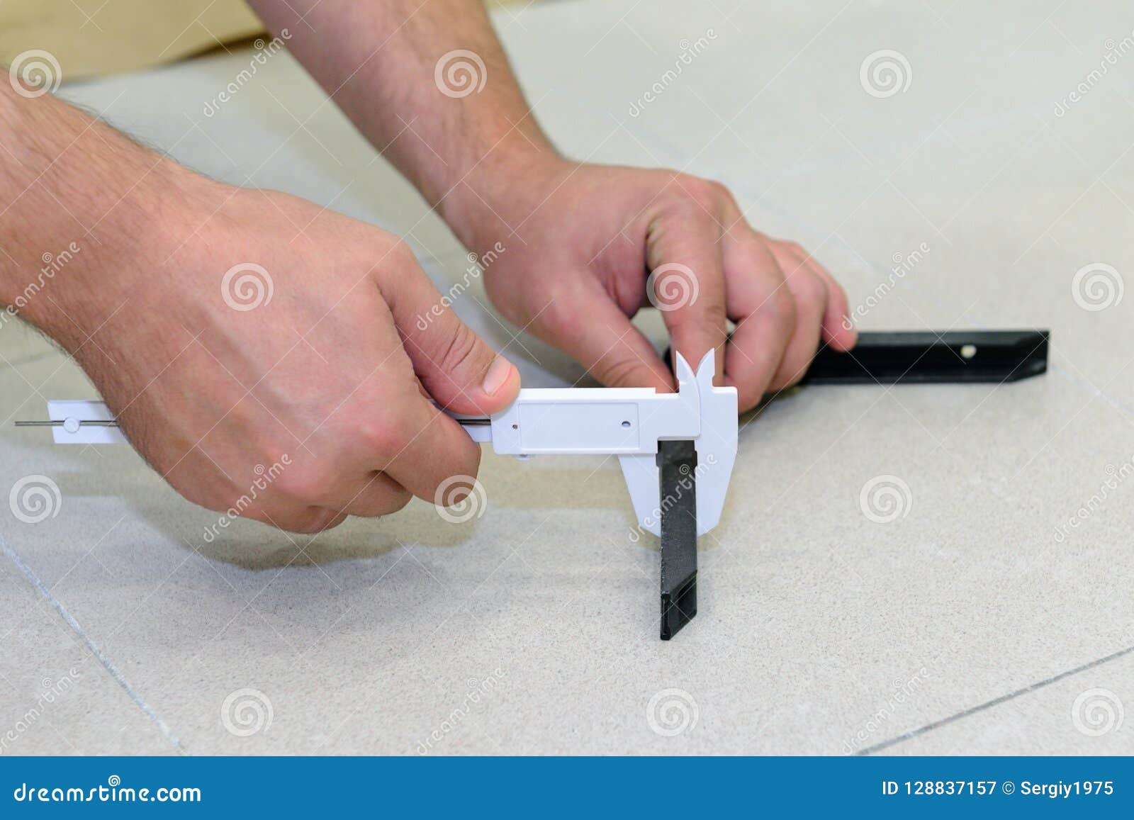 Construction Work, Worker Measure the Detail with a Caliper Stock Image ...