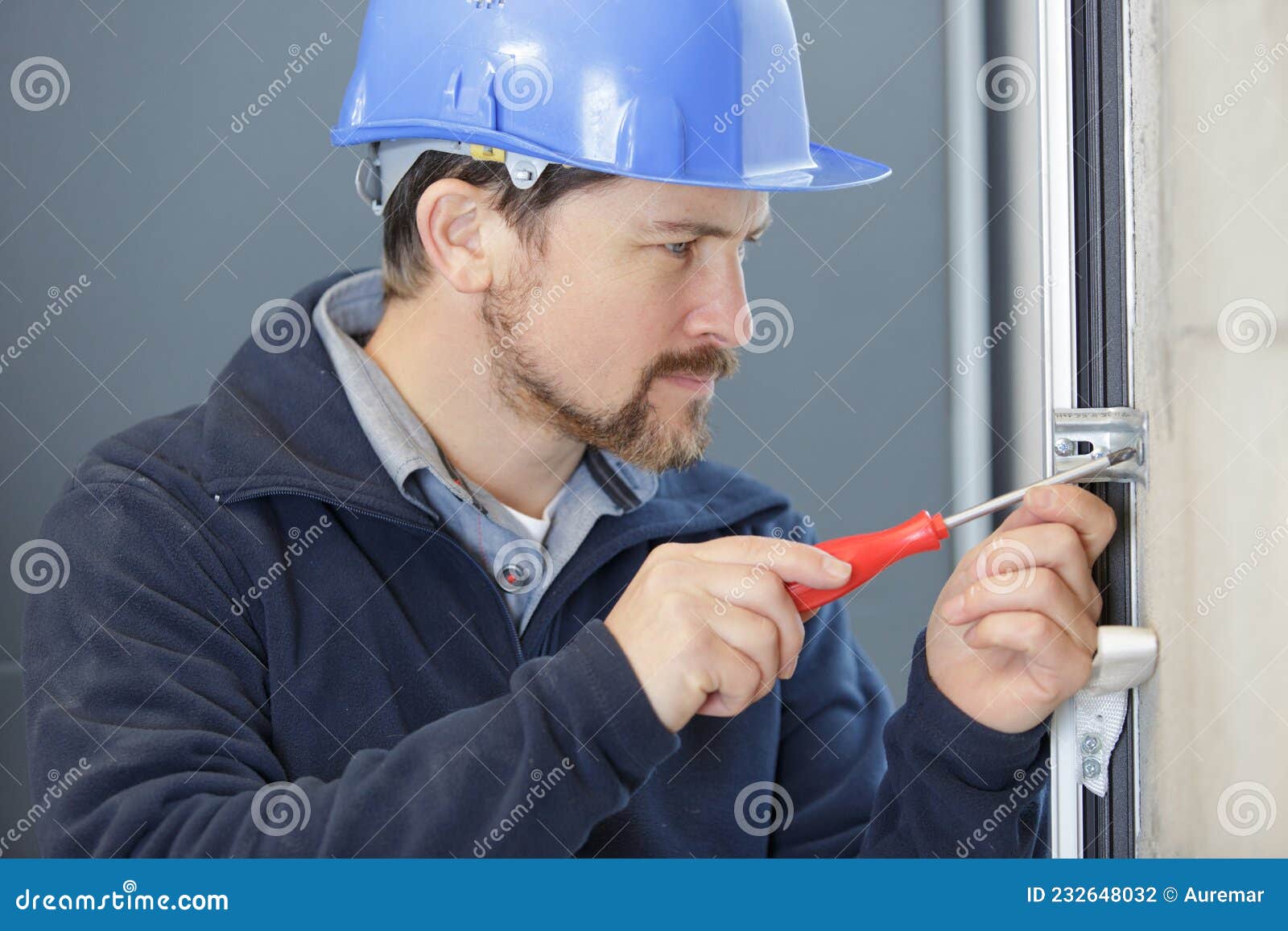 Construction Worker Adjusting Installed Window with Screwdriver Indoors ...
