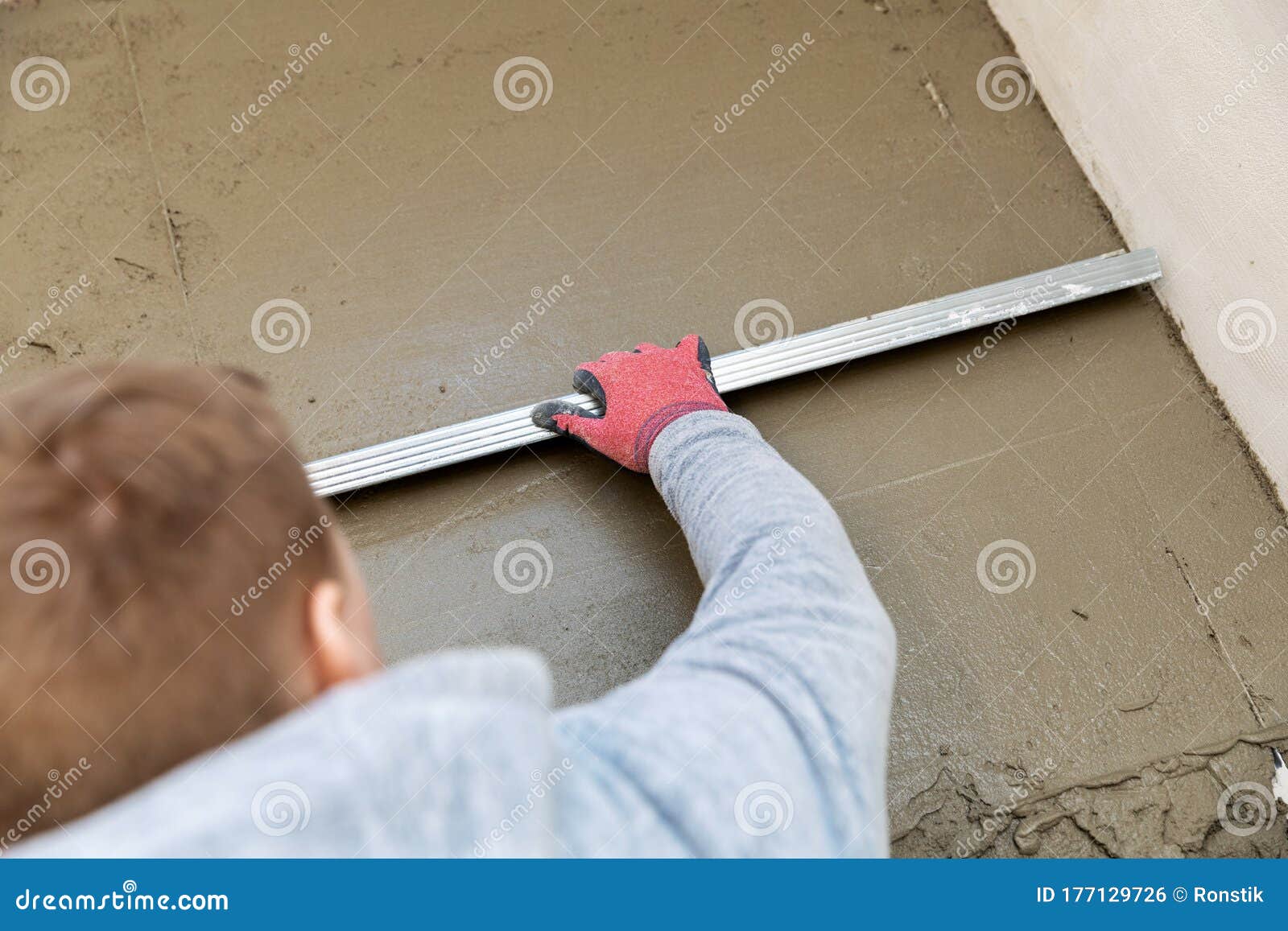 Construction Worker Aligns Concrete Screed Floor Stock Photo - Image of ...