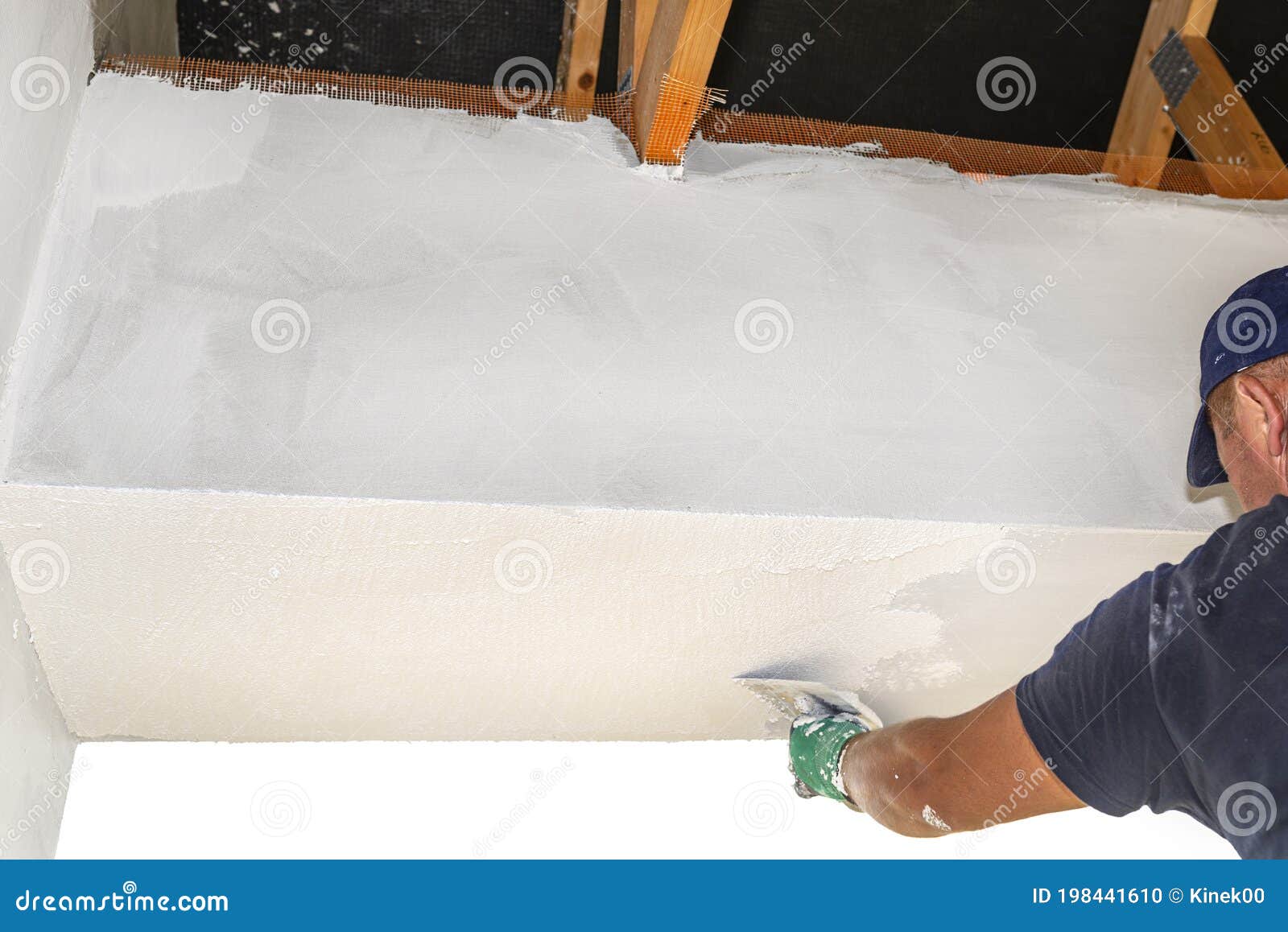 A Construction Worker Applies and Blurs a White Layer of Silicone ...
