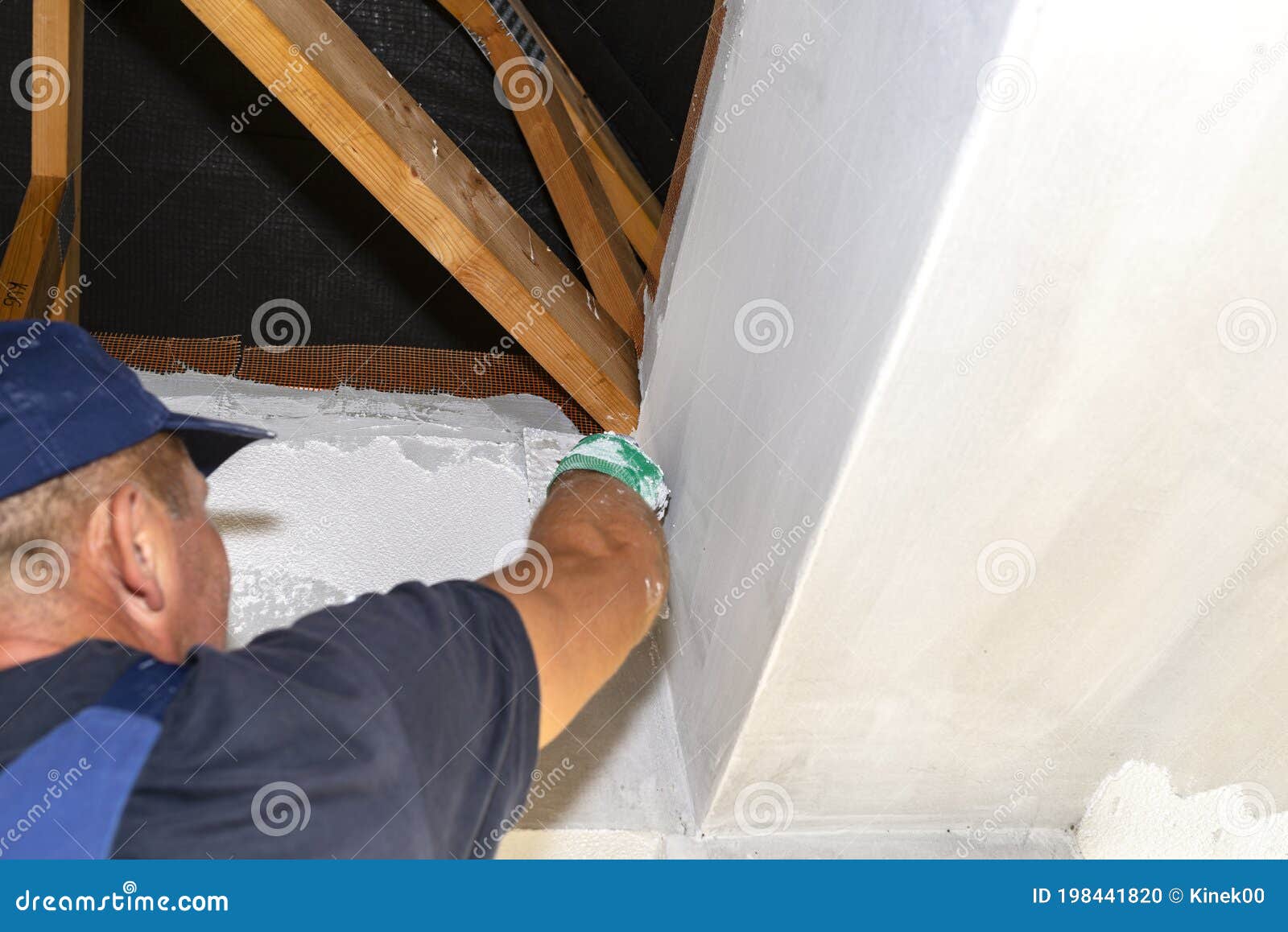 A Construction Worker Applies and Blurs a White Layer of Silicone ...