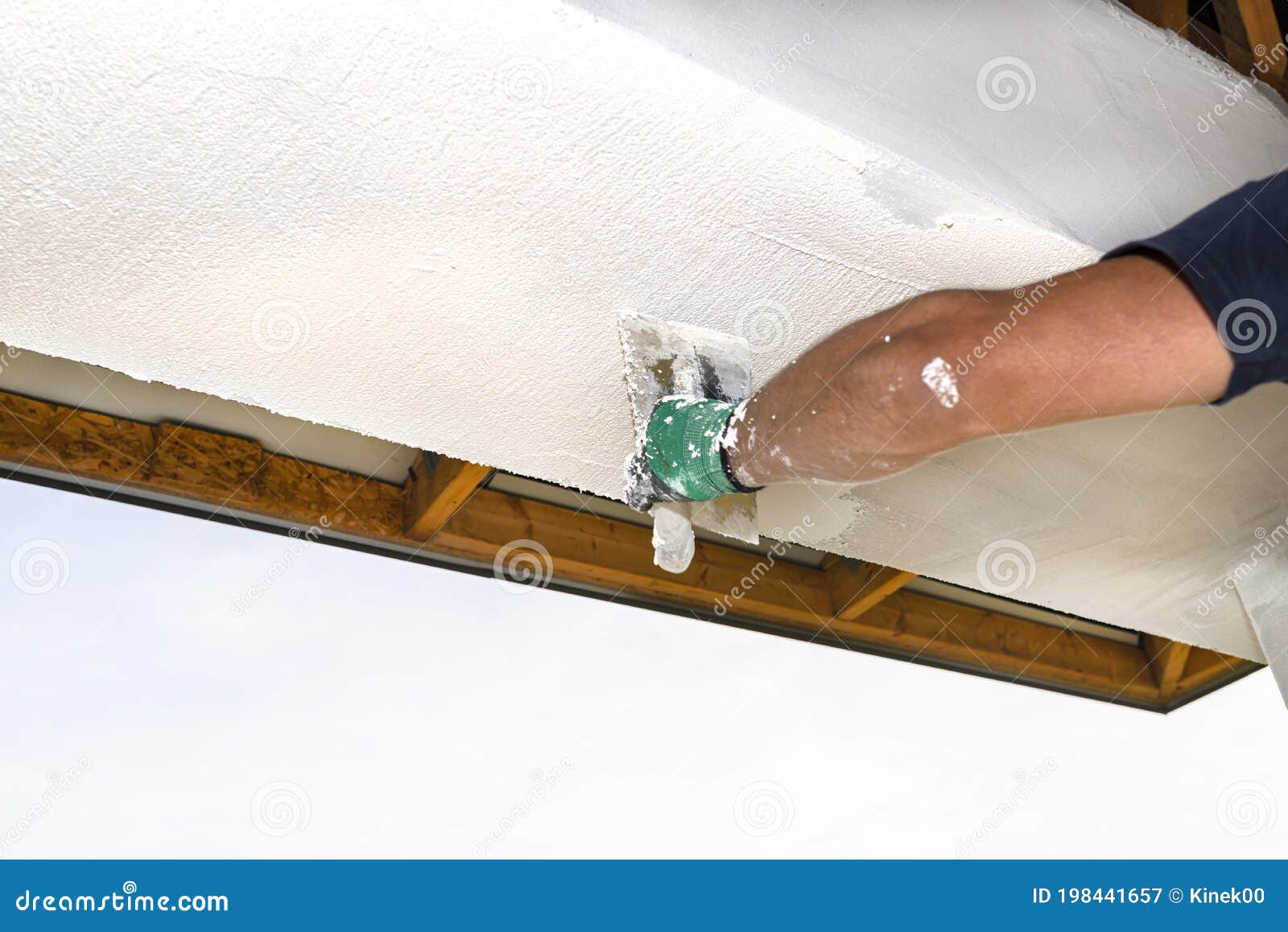 A Construction Worker Applies and Blurs a White Layer of Silicone ...
