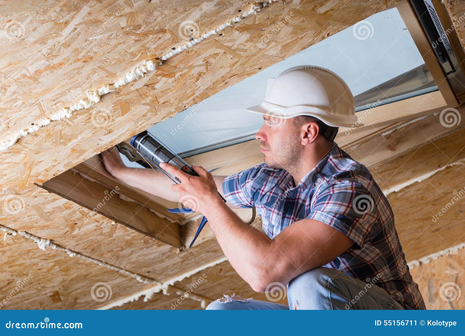 Construction Worker Applying Caulking To Sky Light Stock Image - Image ...