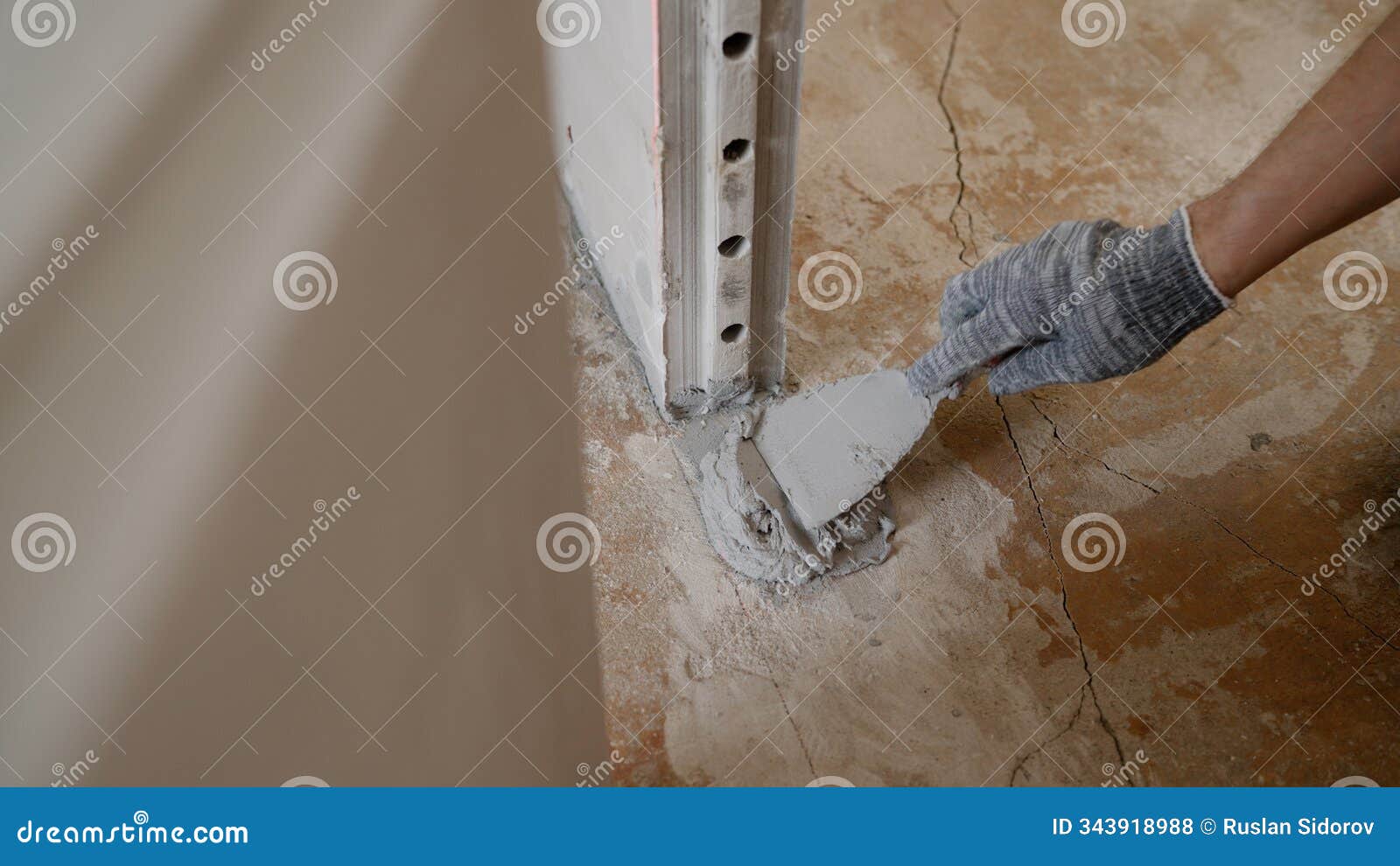 Construction Worker Applying Glue on Lightweight Concrete Block Stock ...